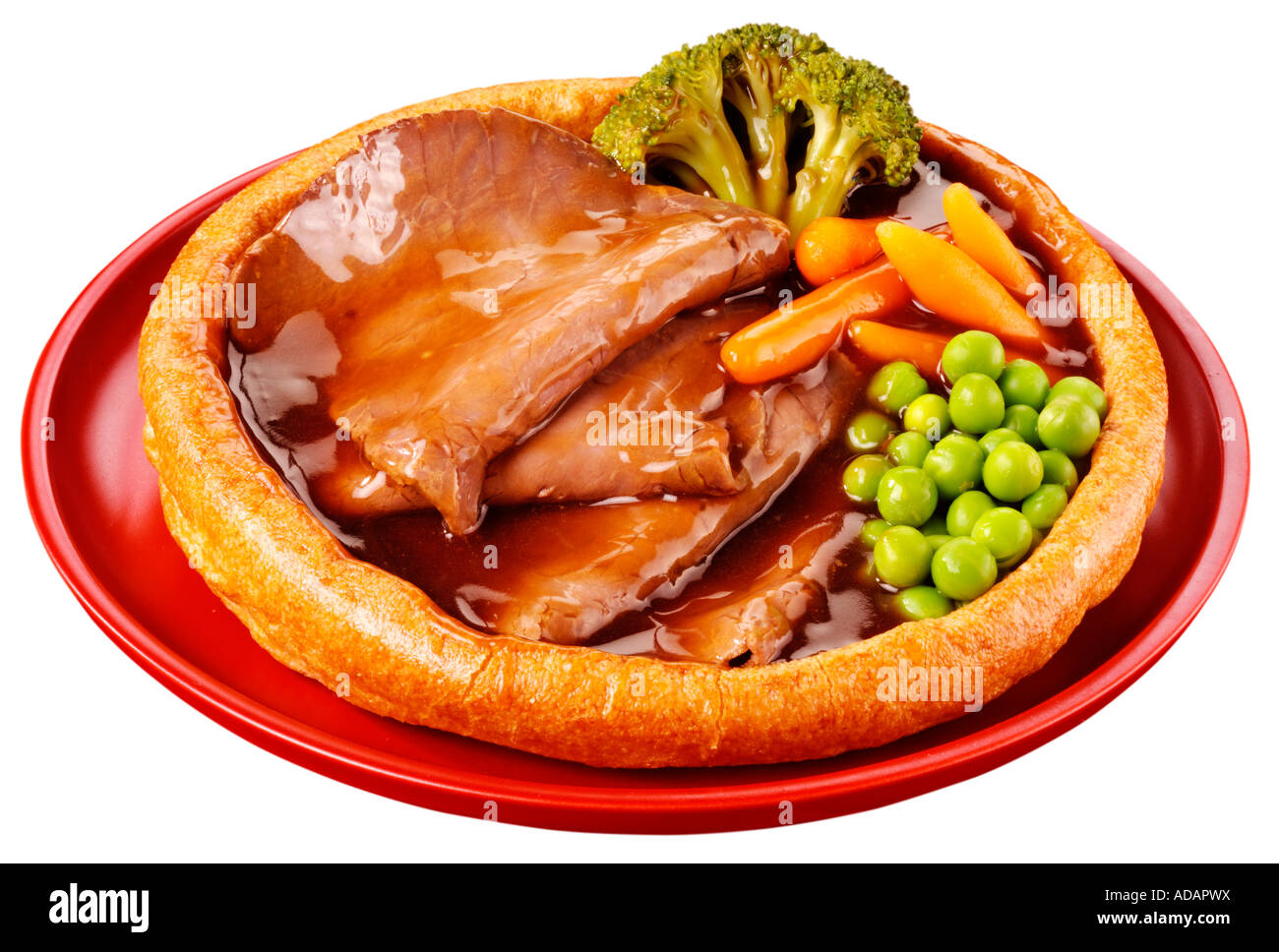 GIANT YORKSHIRE PUDDING WITH ROAST BEEF AND VEGETABLES CUT OUT Stock ...