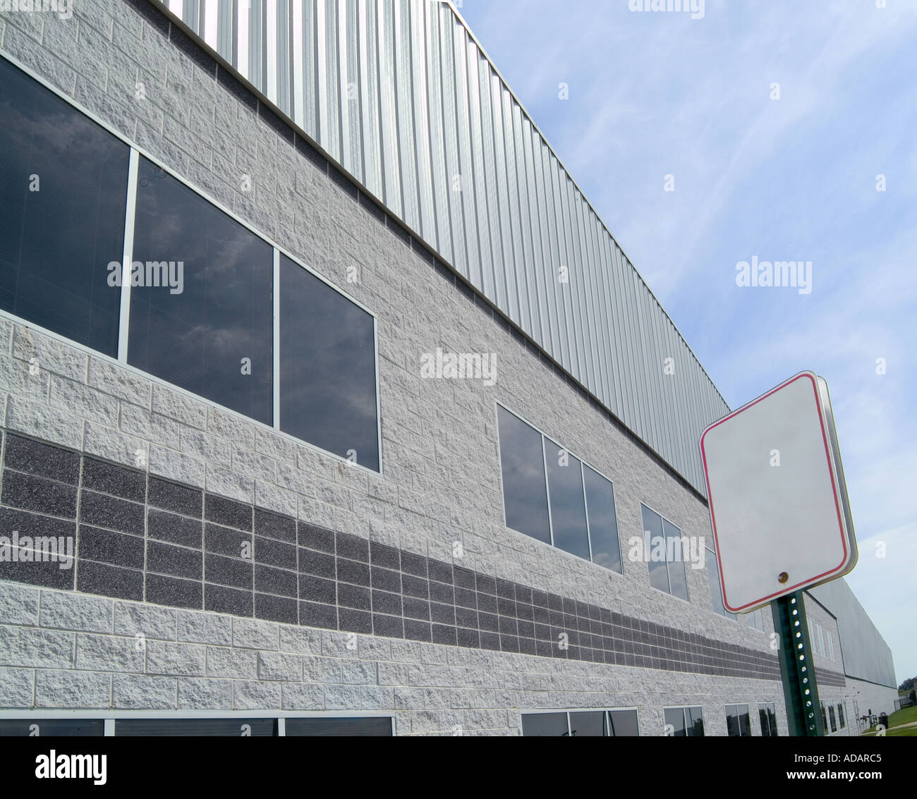 Blank sign outside white building Stock Photo - Alamy