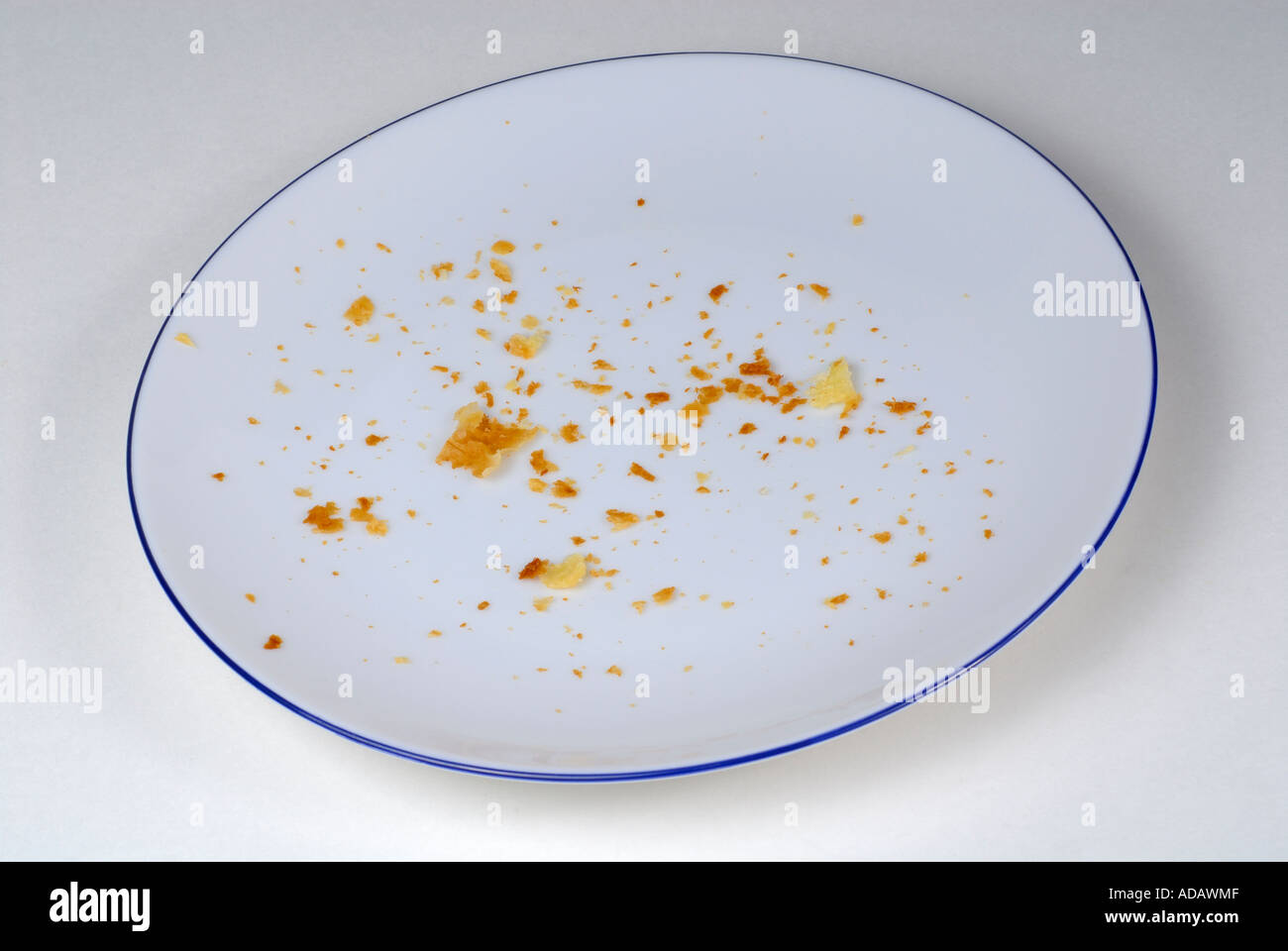 Crumbs on an empty plate Stock Photo - Alamy