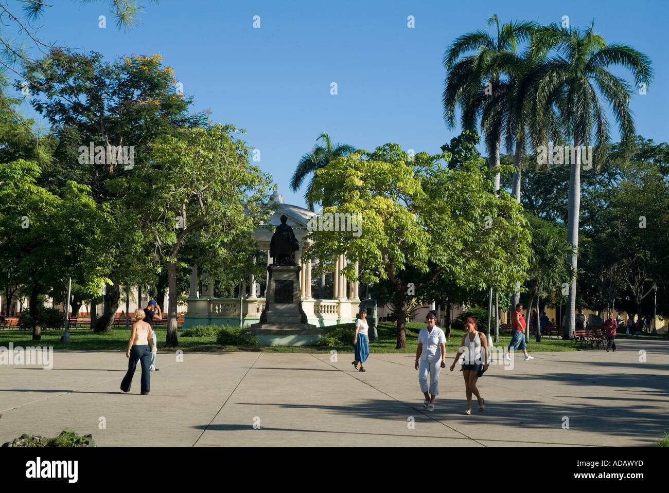 People walking past a bandstand and statue in El Parque Vidal, Santa ...