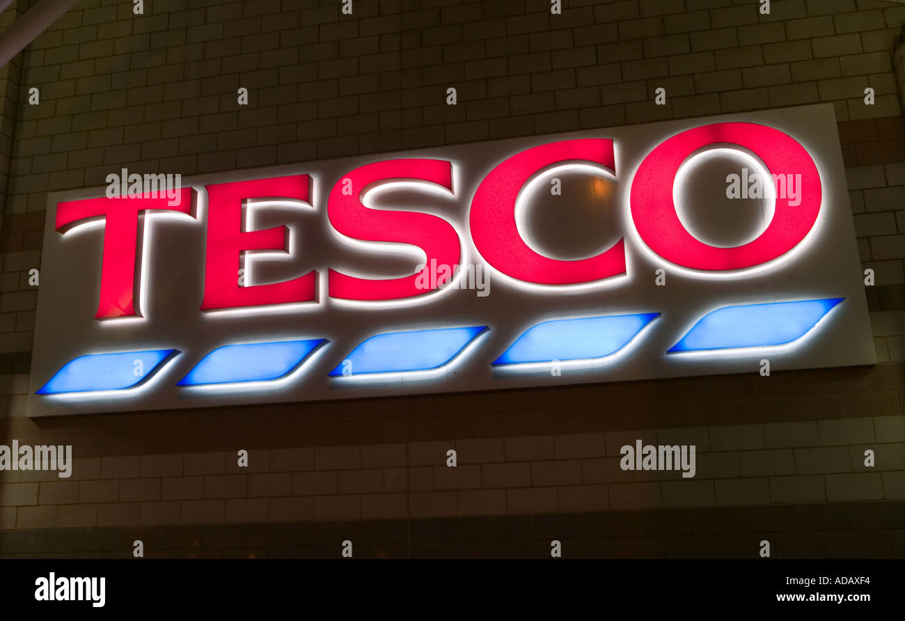 Tesco sign lit at night Penarth Cardiff Wales UK Stock Photo - Alamy
