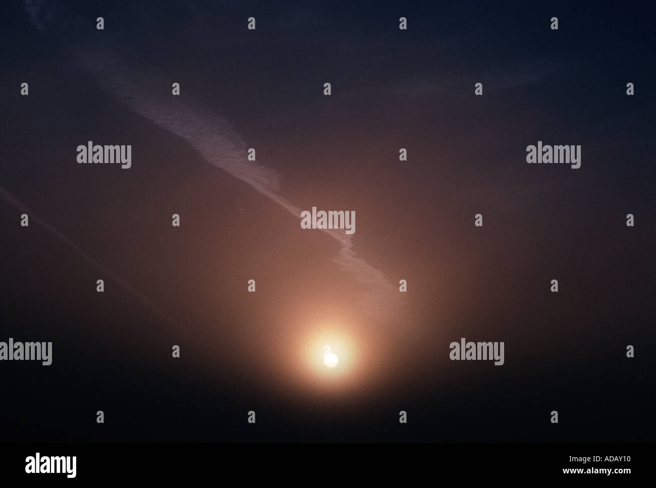 Sunlight breaking through haze and fog at dawn Stock Photo - Alamy