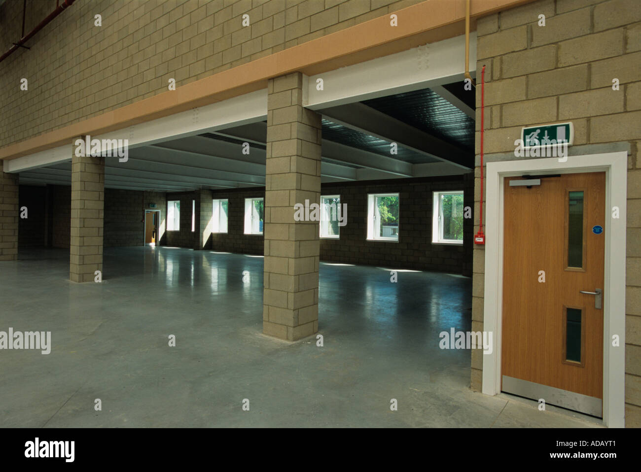 view of inside of modern warehouse / facoriy showing exit / egress ...