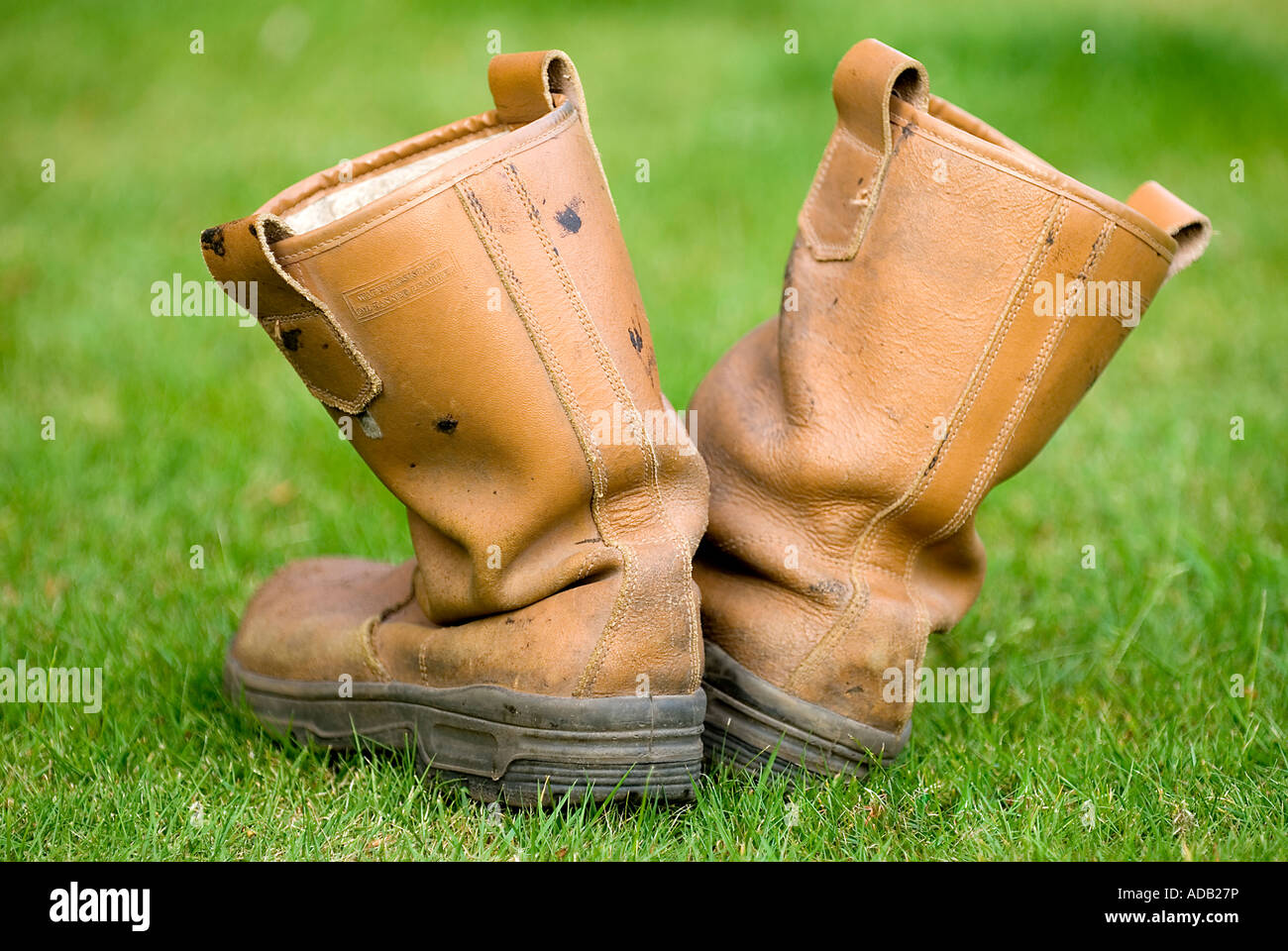pair of working boots in garden Stock Photo - Alamy