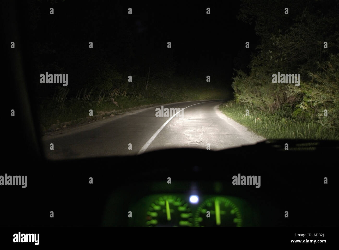 Drivers View from the Interior of a Car Driving at Night Along an ...