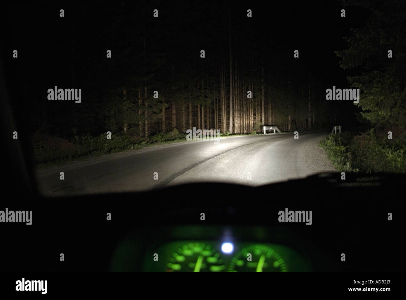 Drivers View from the Interior of a Car Driving at Night Along an ...