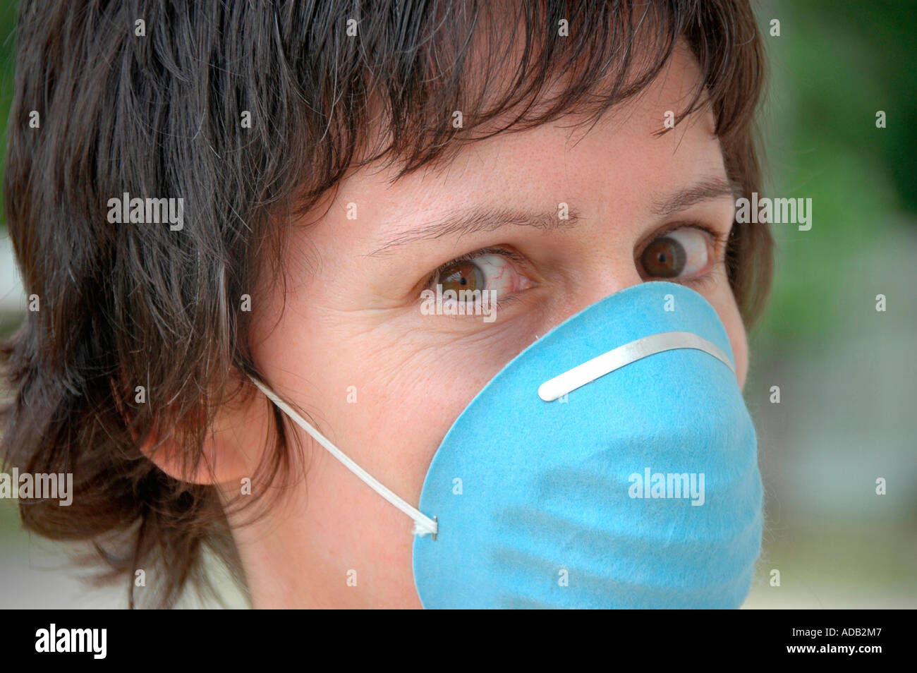 Woman wearing sanitary sterile face mask for hygienic reasons because ...