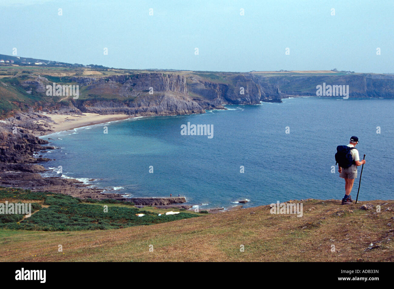 gower peninsula mewslade bay clifftop view hiker swansea south wales uk ...