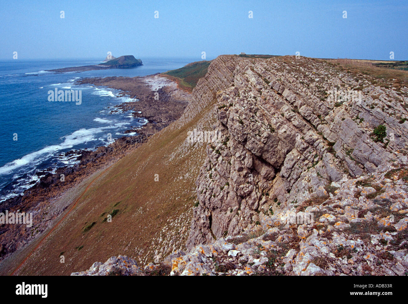 gower peninsula view to worms head strata rock formation cliff's ...