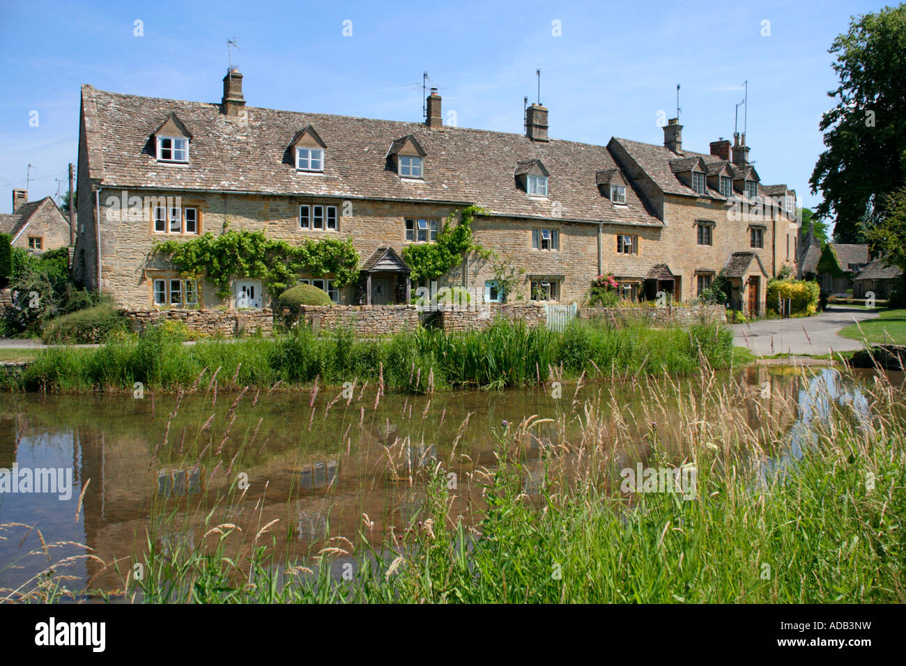 Lower Slaughter quaint village by stream cotswolds stone houses england ...