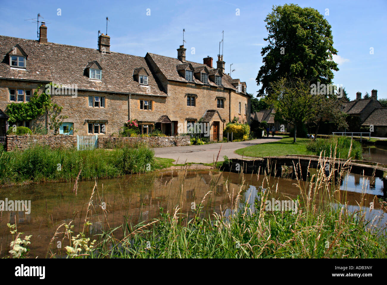 Lower Slaughter quaint village by stream cotswolds stone houses england ...