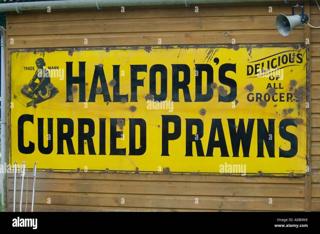 Advertisement sign for Halford's curried prawns Stock Photo - Alamy