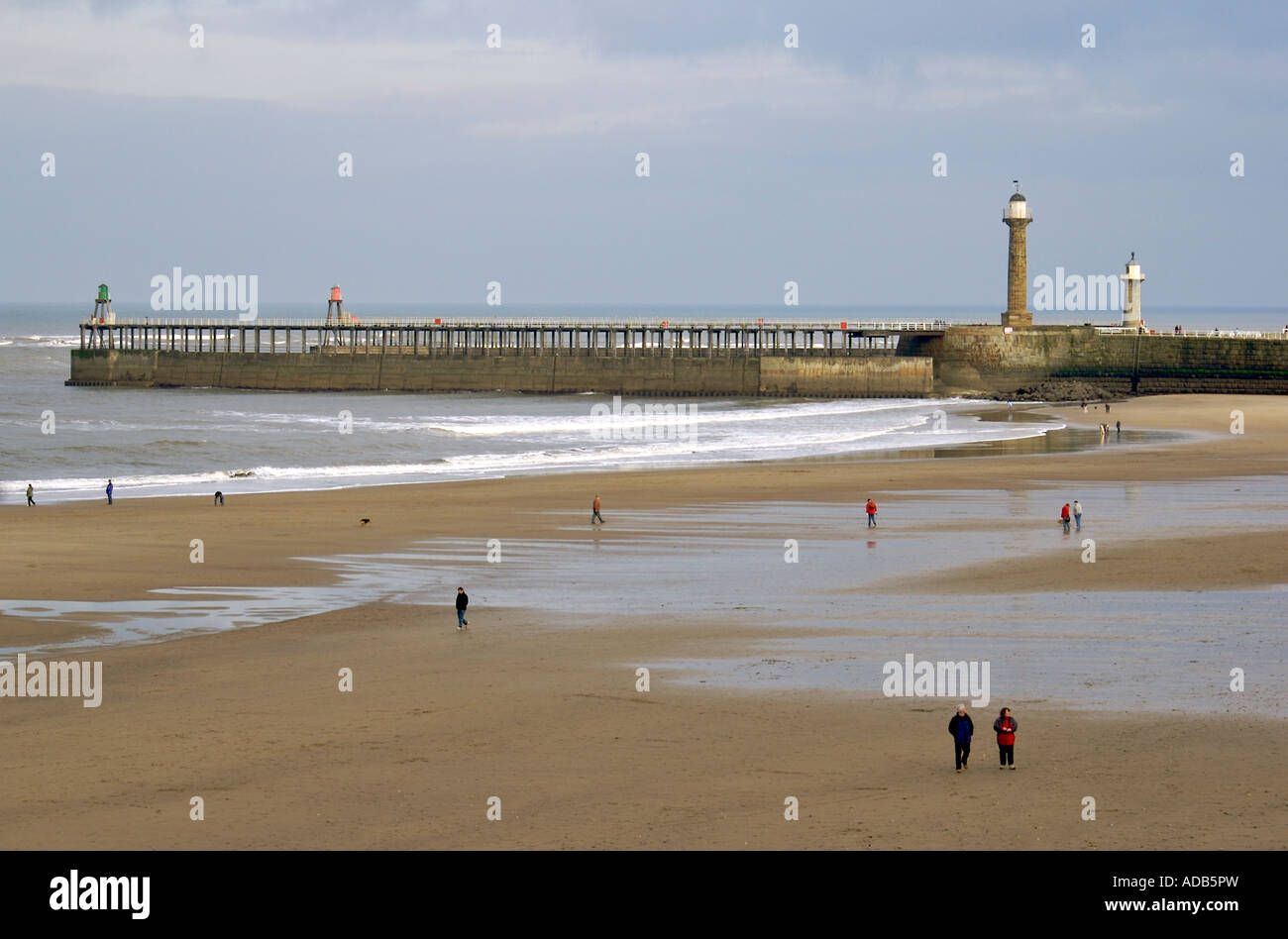 View of Whitby beach and pier North Yorkshire UK Stock Photo - Alamy