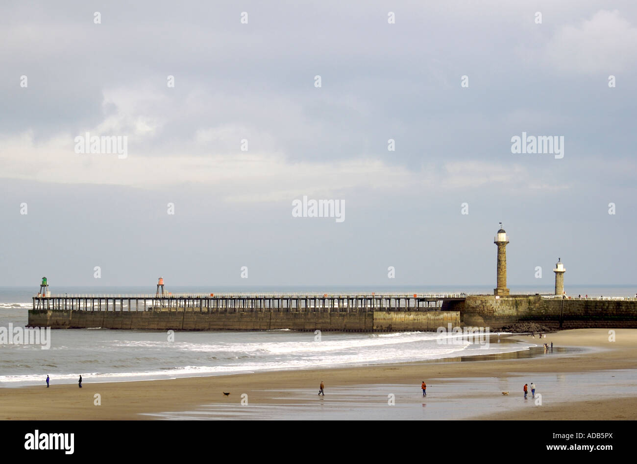 View of Whitby beach and pier North Yorkshire UK Stock Photo - Alamy
