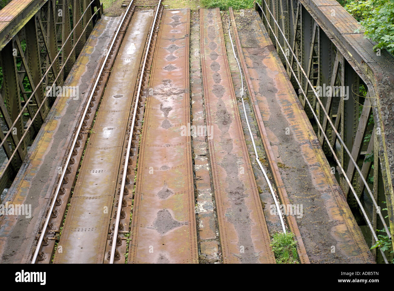 Disused train tracks across a bridge Cromford Derbyshire Stock Photo ...