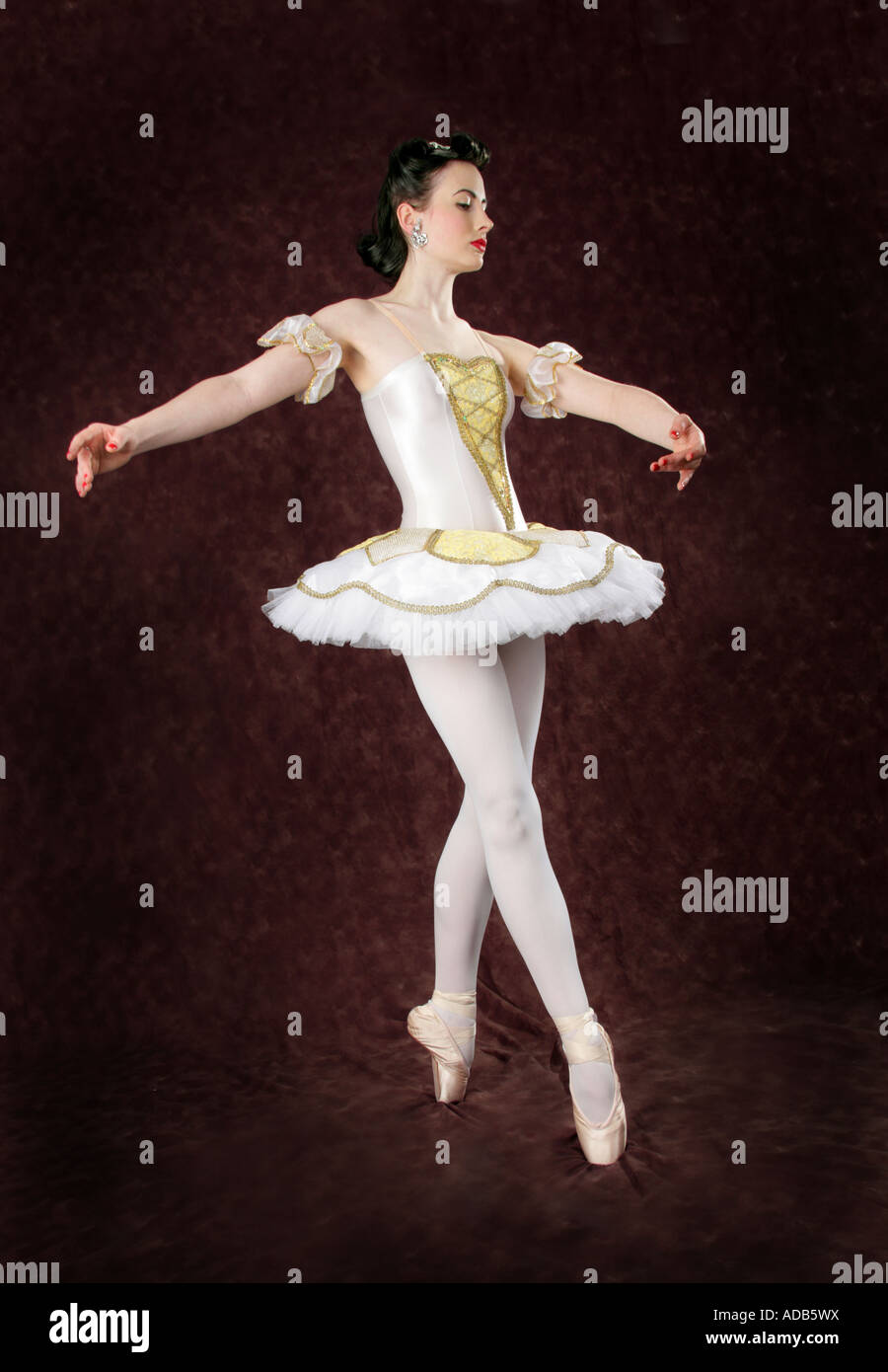 Ballerina in a White and Yellow Ballet Costume Stock Photo - Alamy