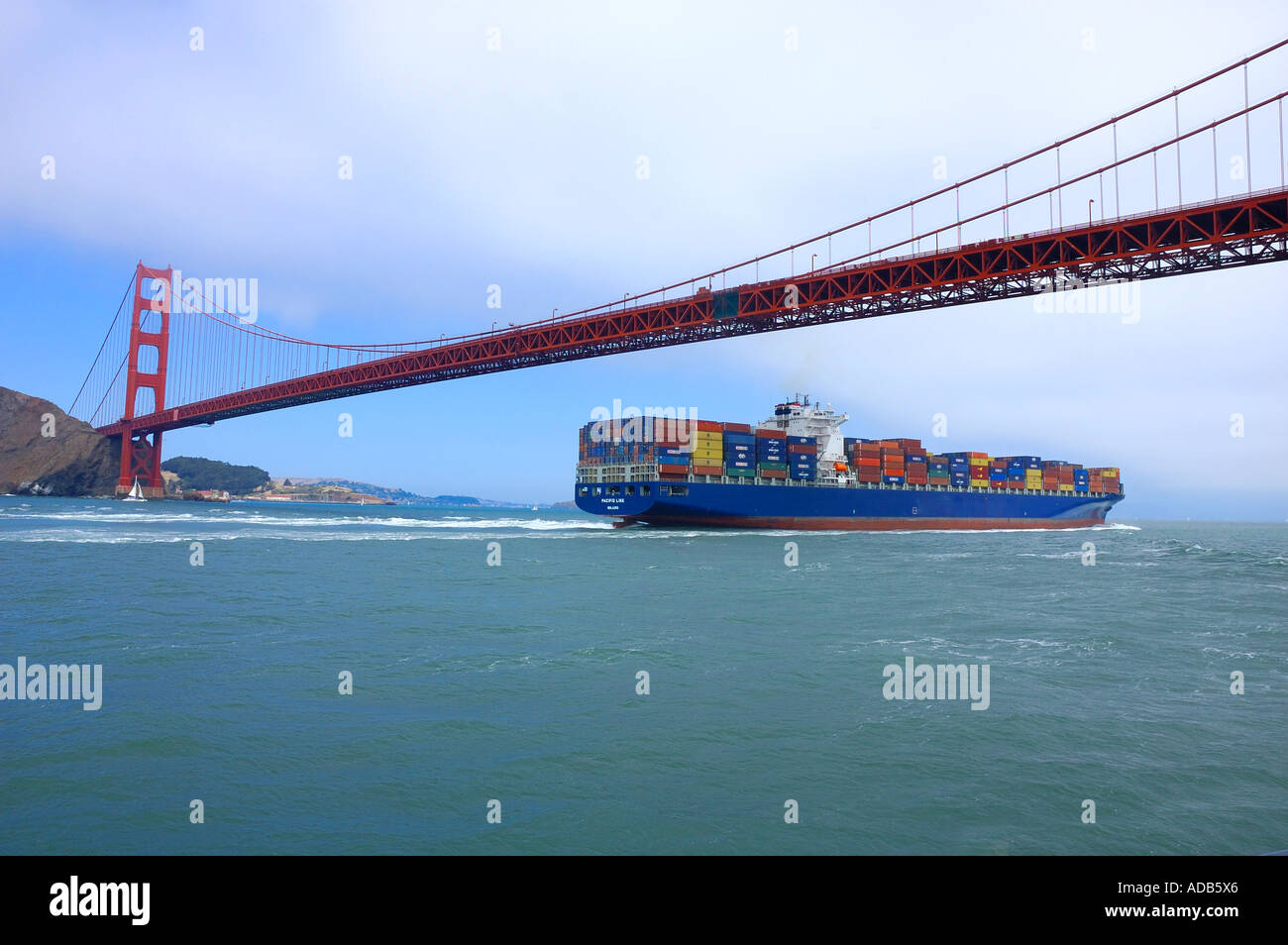 Container ship passing under golden gate bridge hi-res stock ...