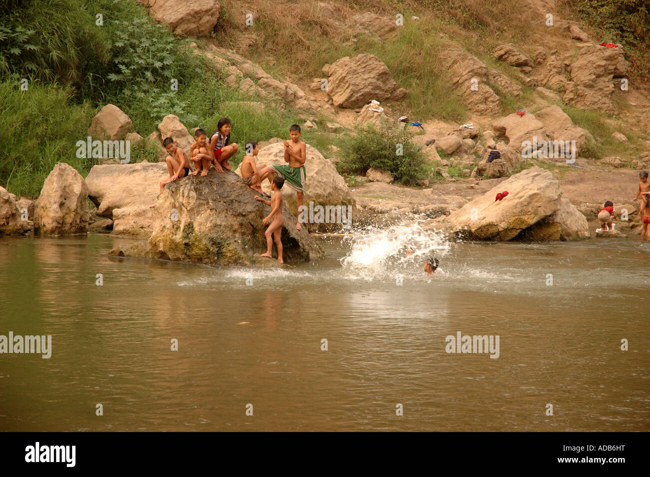 Kids playing in the Mekong River in Luang Prabang, Laos Stock Photo - Alamy