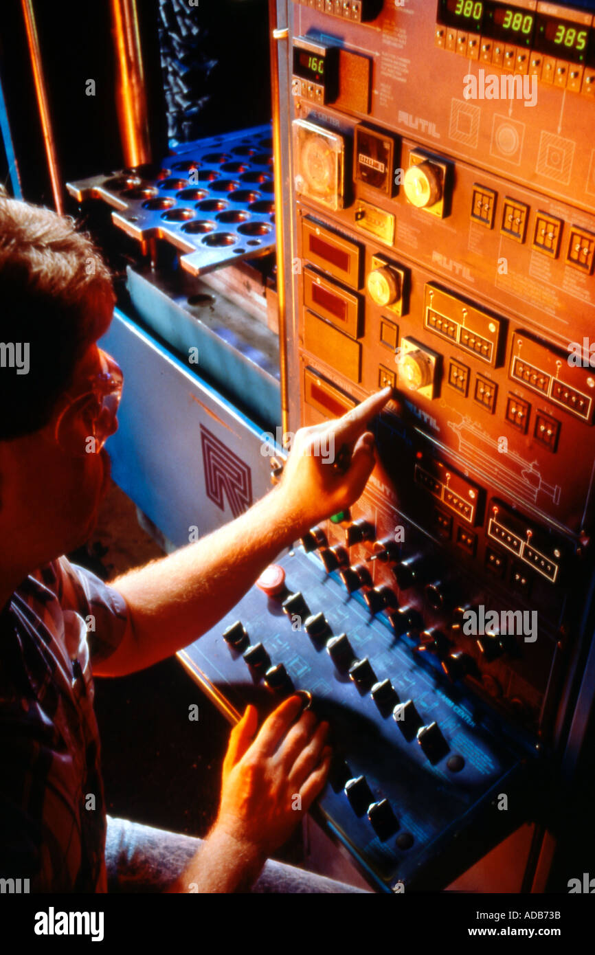 Industrial technician at electronic control panel Stock Photo - Alamy