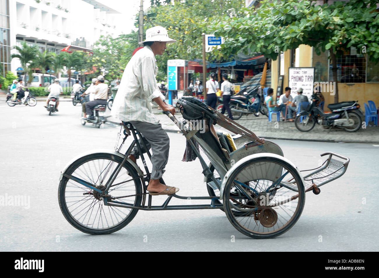 Vietnamese man on a rickshaw in Hanoi Stock Photo - Alamy