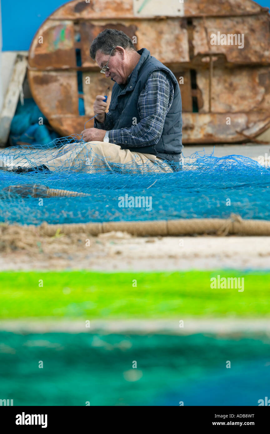 Commercial fisherman mending nets hi-res stock photography and images ...