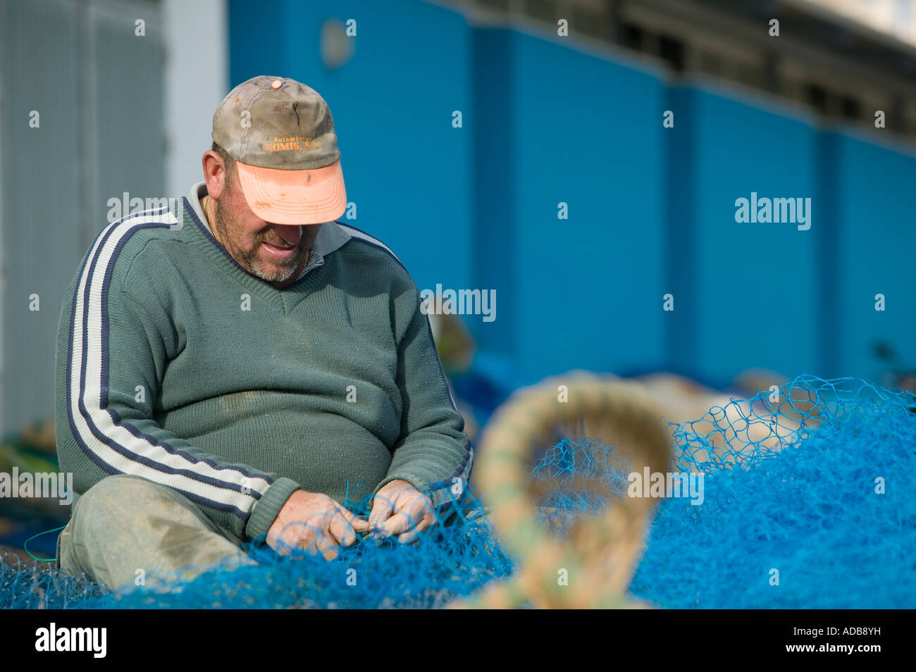 Commercial fisherman mending nets hi-res stock photography and images ...