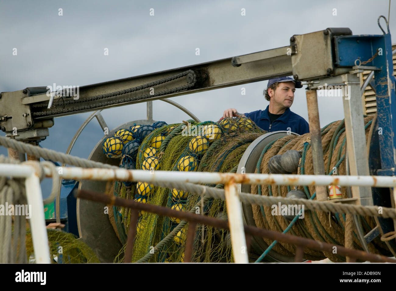 Trawlerman preparing nets Stock Photo - Alamy