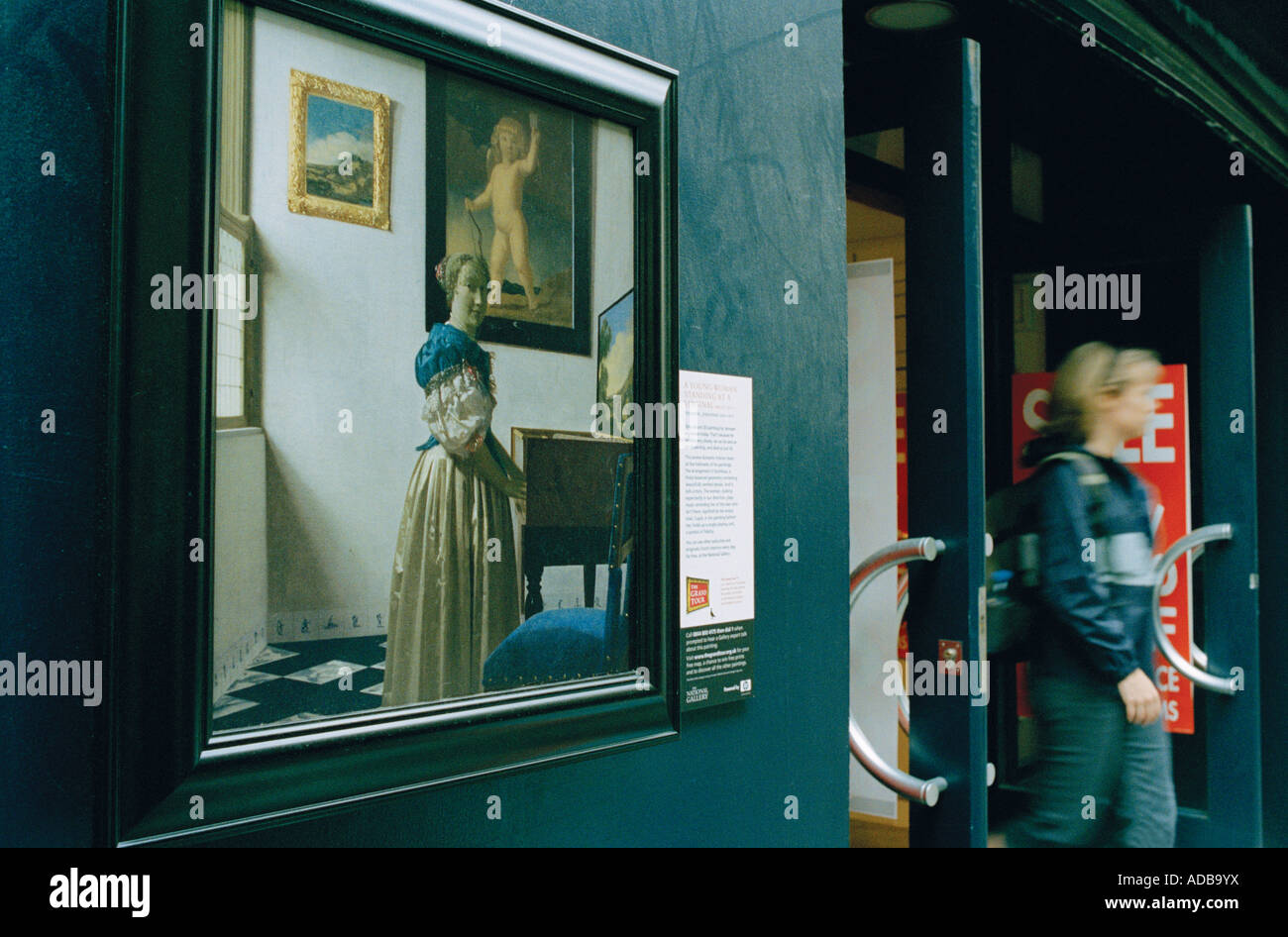 A Young Woman standing at a Virginal by Johannes Vermeer. Part of The ...