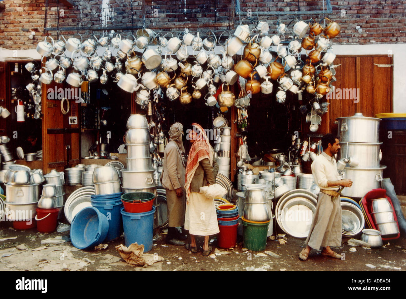 Two Men Bartering Outside a Hardware Shop that Sells Pots, Pans Dishes ...