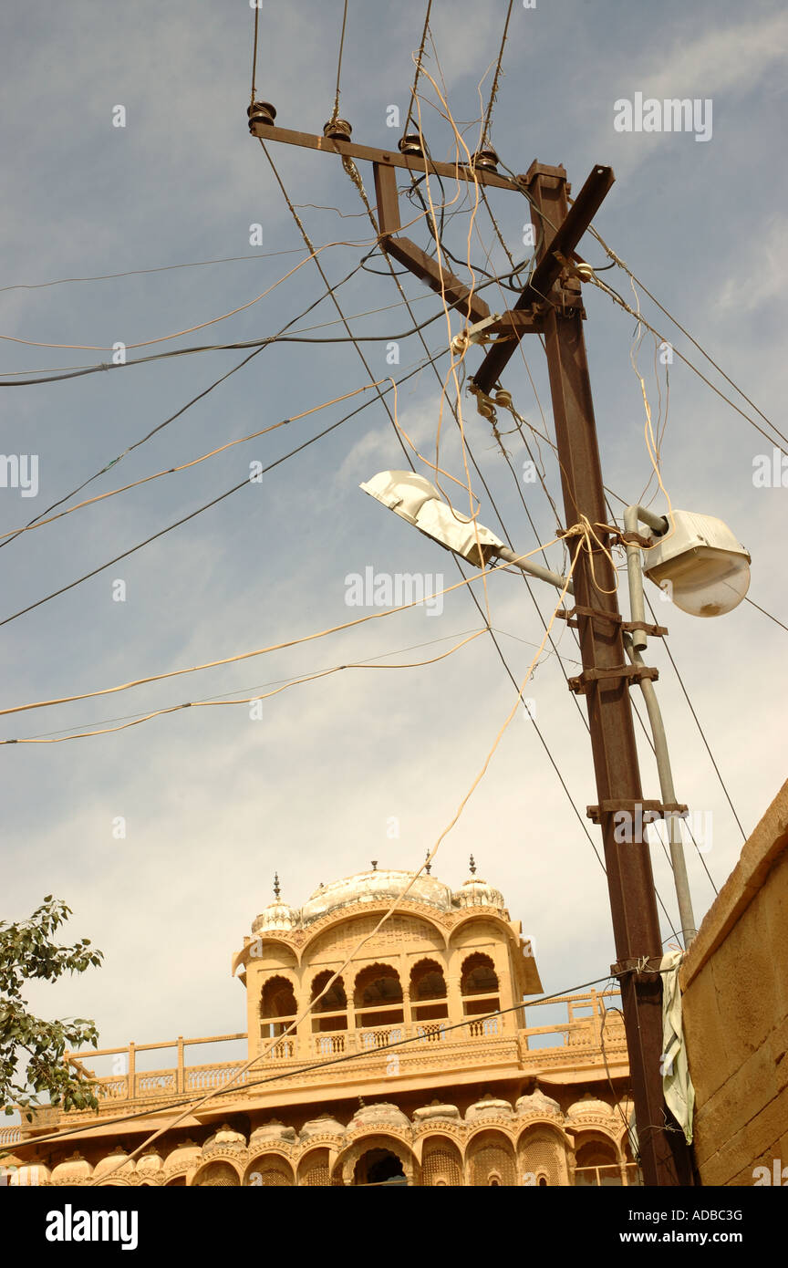 Telephone pylon in Rajasthan with backdrop of an old traditional Indian ...