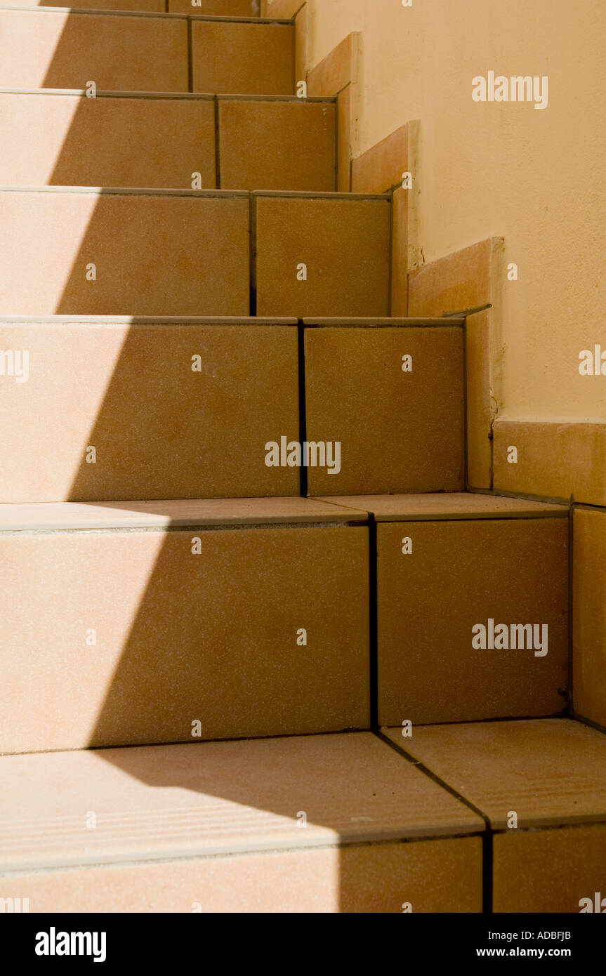 Terracotta steps in shadow Stock Photo - Alamy