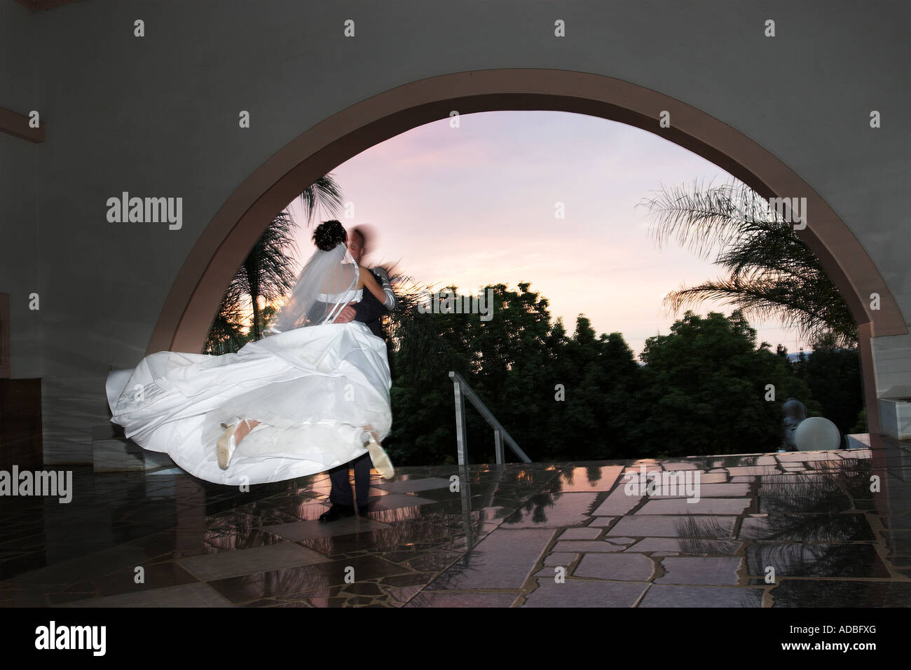 groom swinging his bride Stock Photo - Alamy