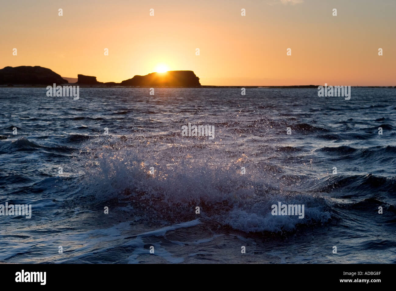 Sunset at Runswick Bay North East Yorkshire Coast England and reflected ...