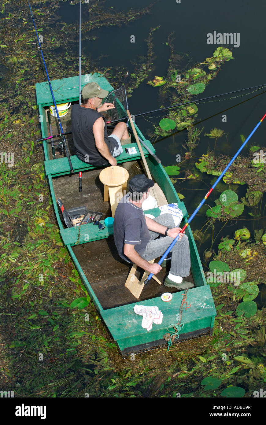 Men fishing from river boat, Angles-sur-l'Anglin (86260), Vienne ...