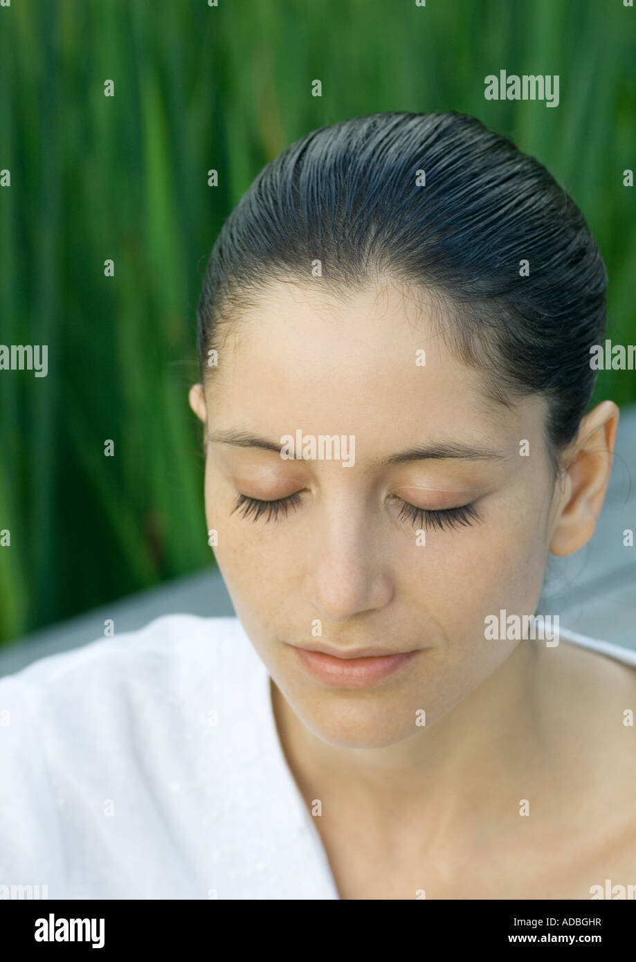 Woman with eyes closed, head and shoulders, portrait Stock Photo - Alamy