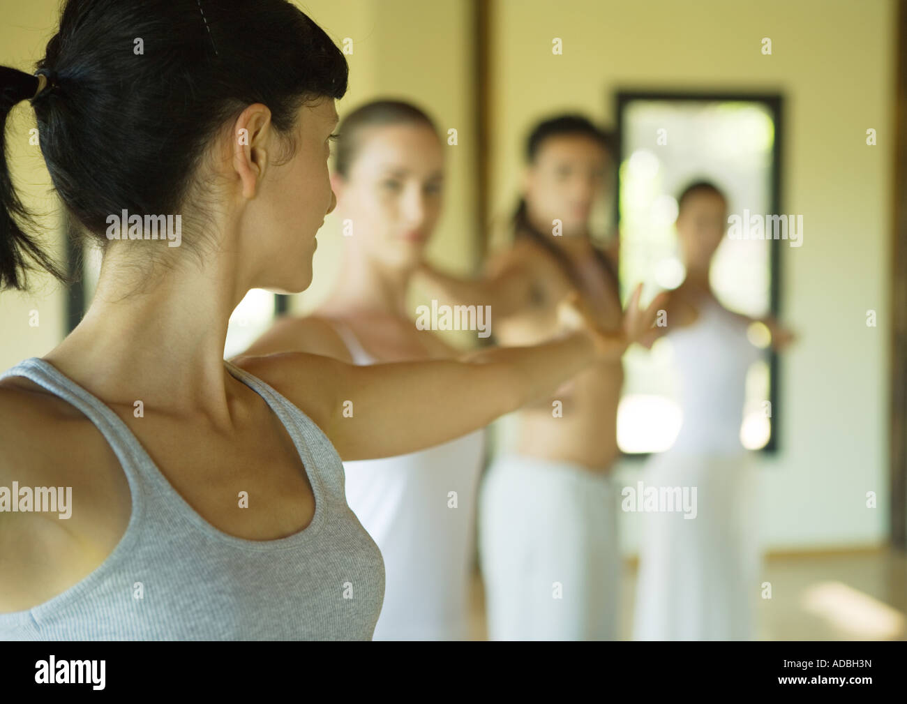 Exercise class stretching arms out Stock Photo - Alamy
