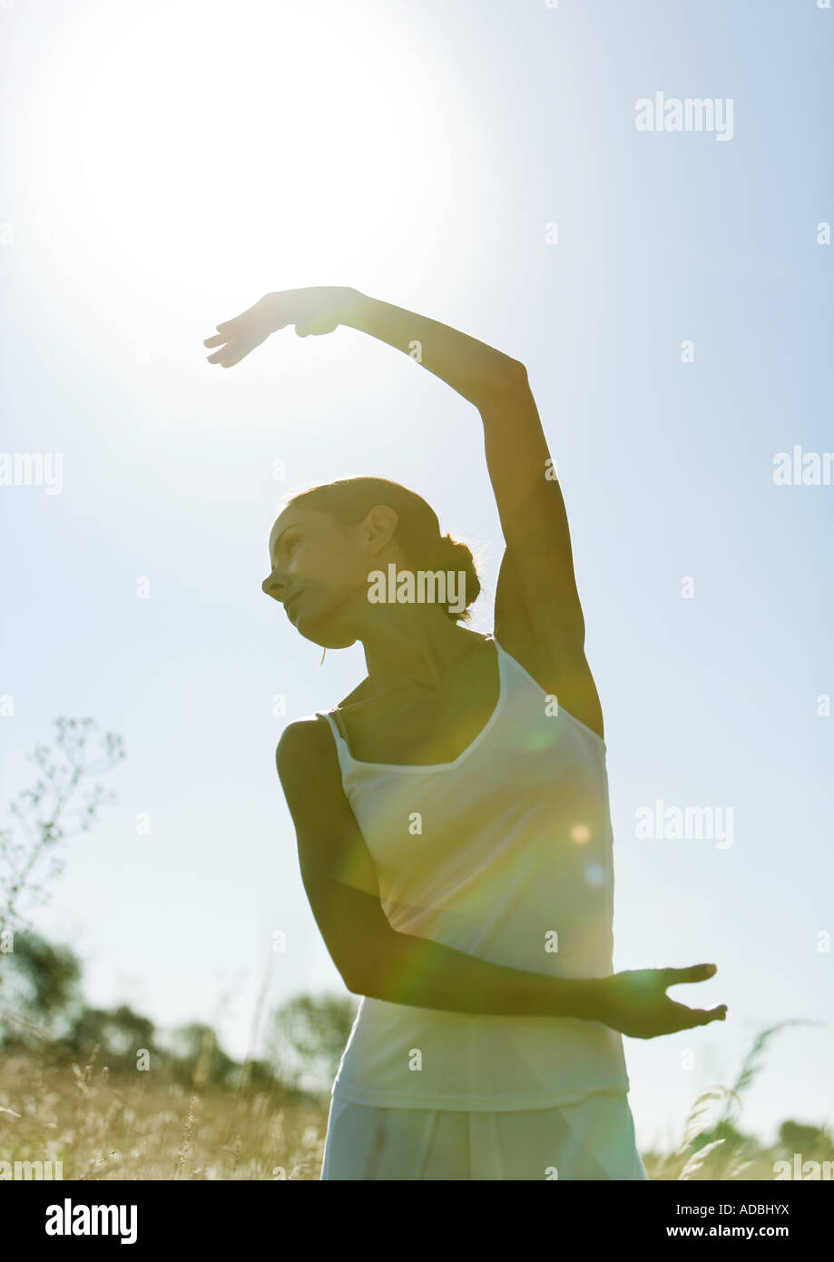 Woman dancing in field Stock Photo - Alamy