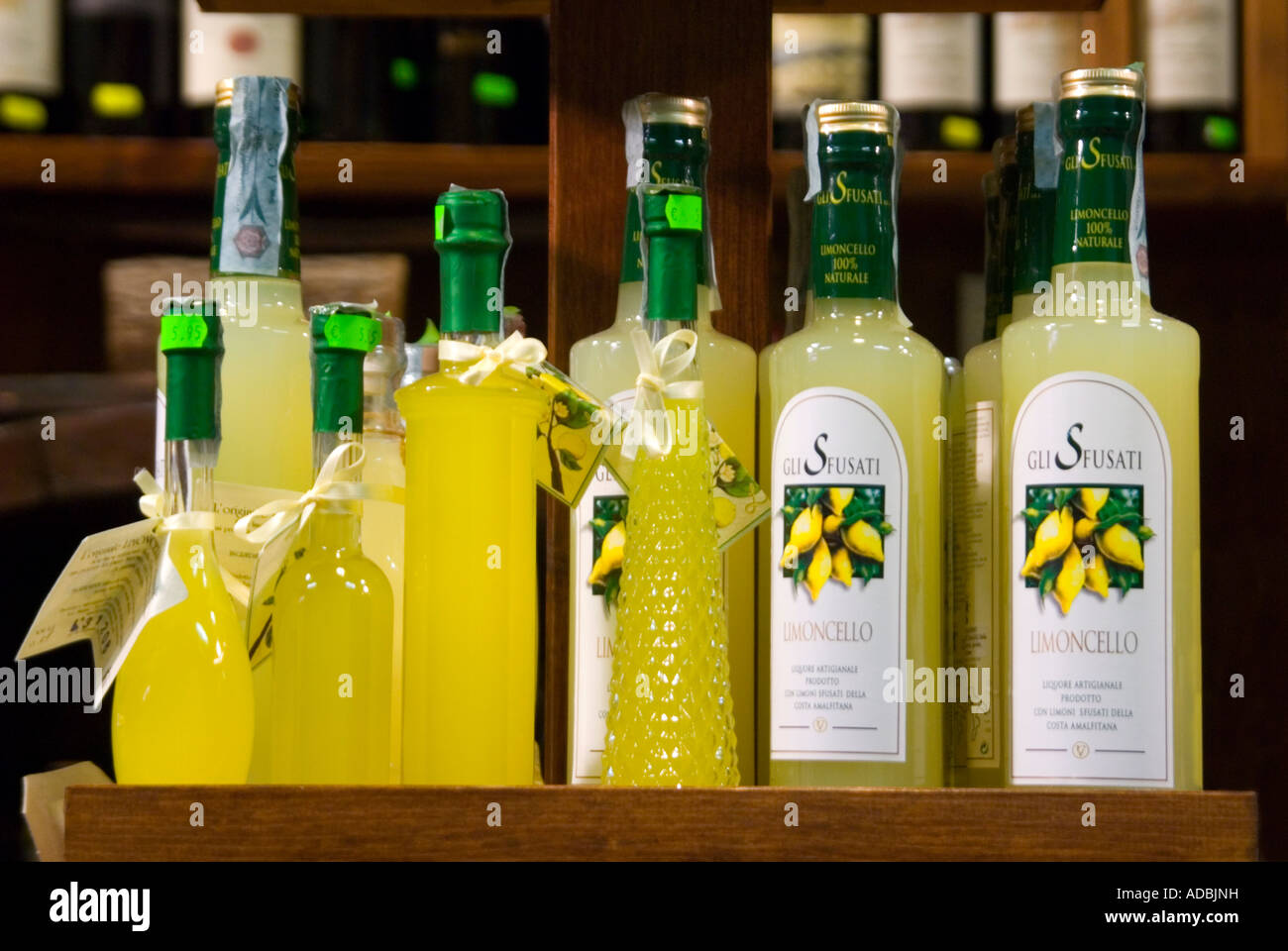 Horizontal close up of bottles of the bright yellow Italian Limoncello ...