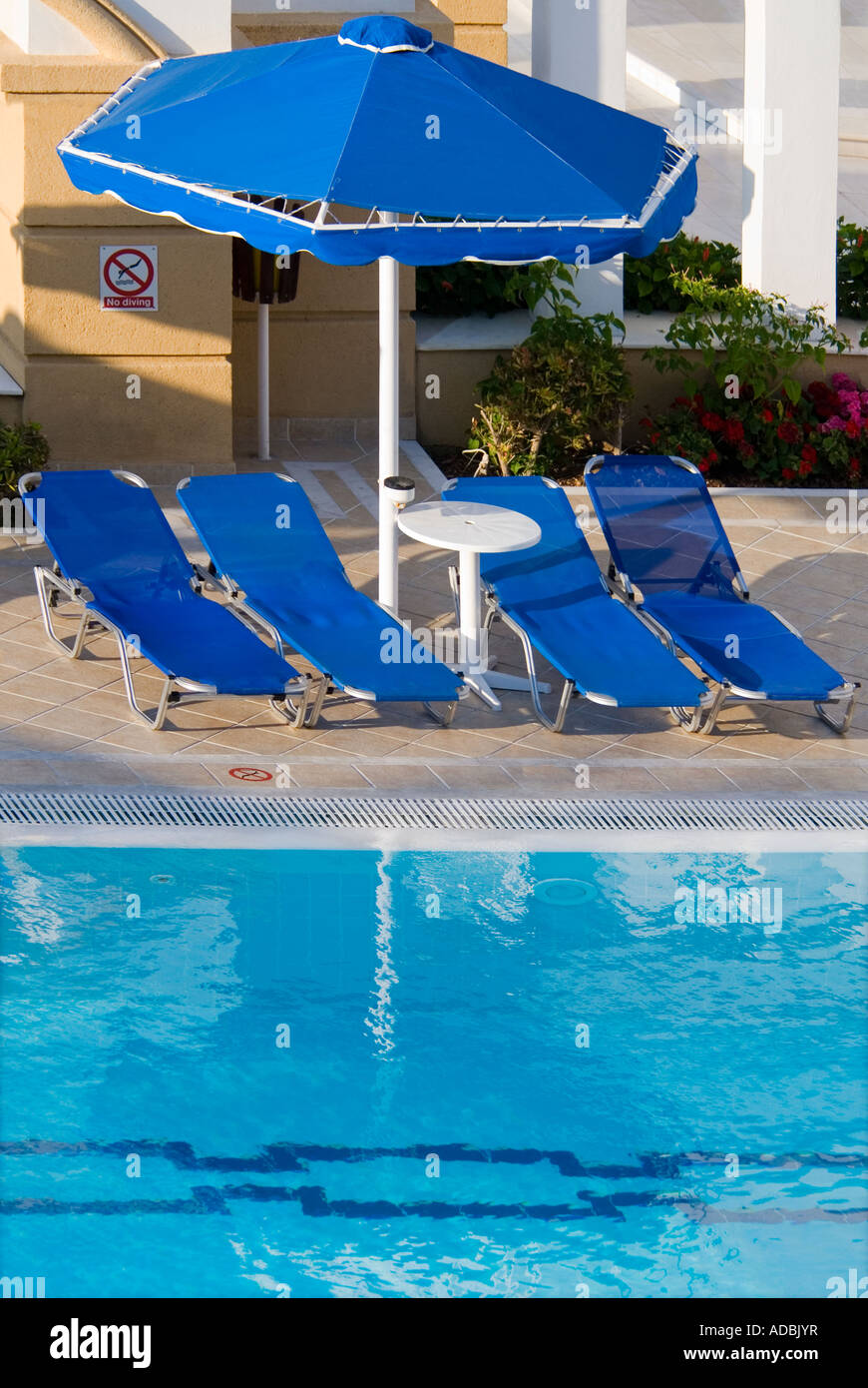 Vertical aerial view of an inviting outdoor swimming pool surrounded by ...