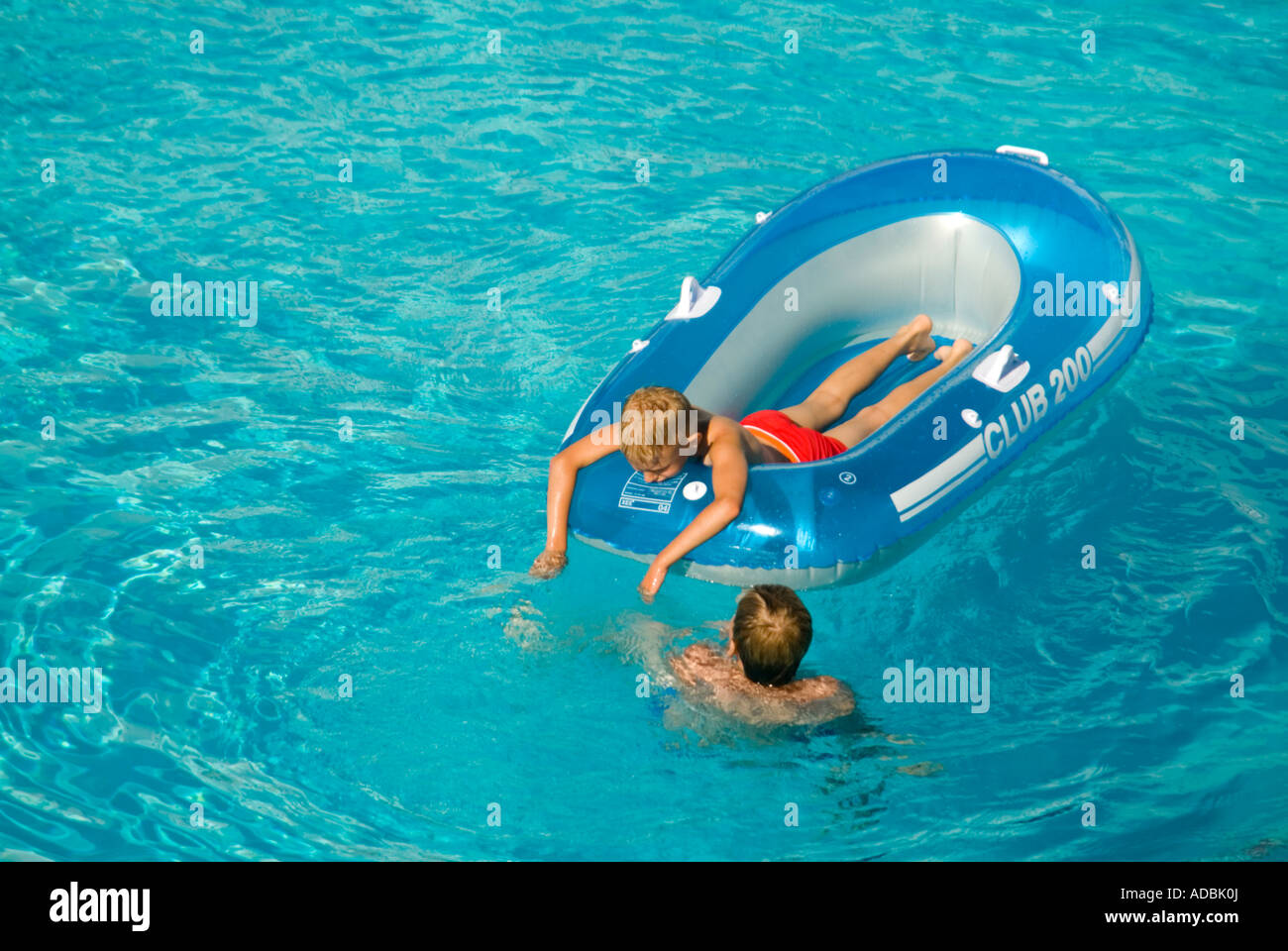 Children playing in inflatable boat hi-res stock photography and images ...