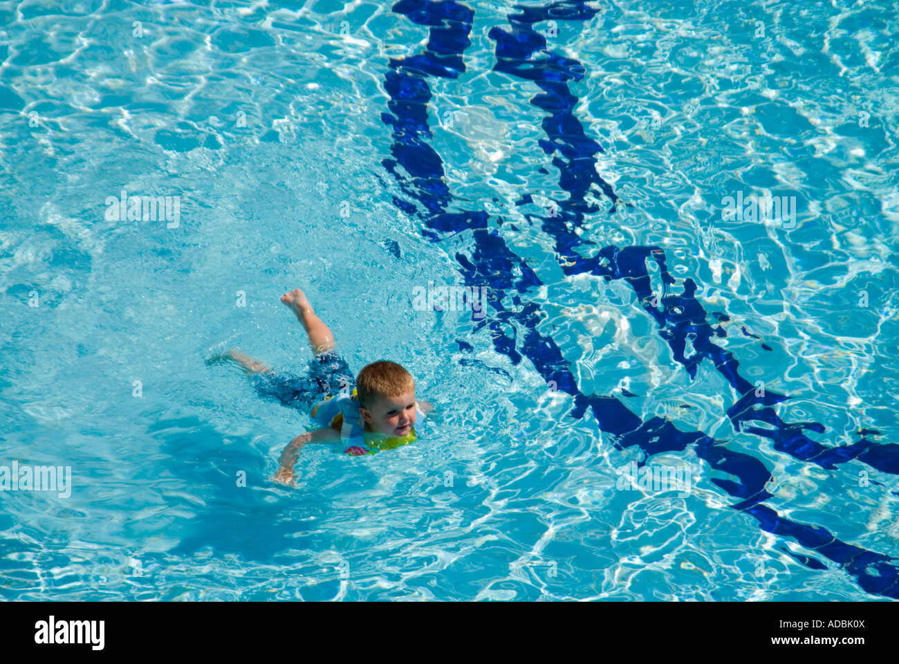 Kid swimming kicking hi-res stock photography and images - Alamy