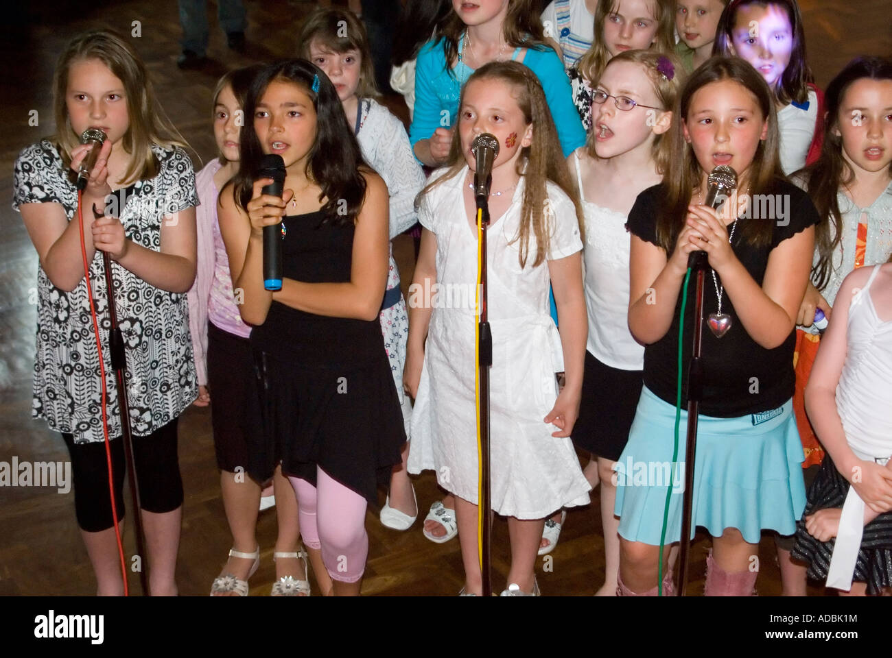 Horizontal close up of a group of female children around several ...