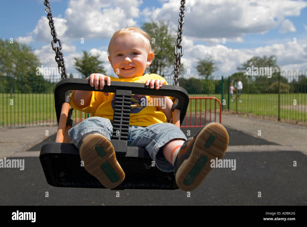 Pushed child on swing hi-res stock photography and images - Alamy