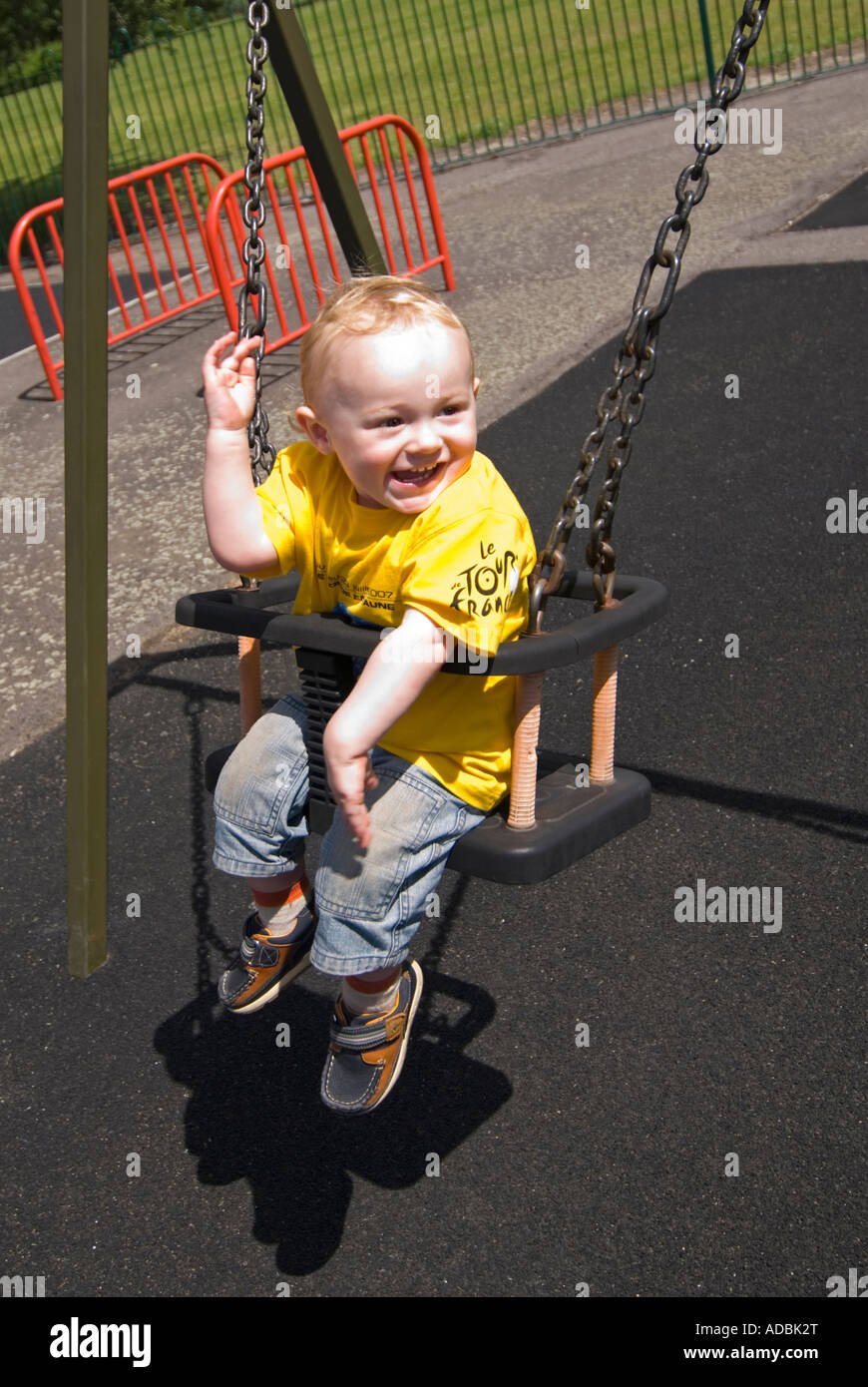 Pushed child on swing hi-res stock photography and images - Alamy