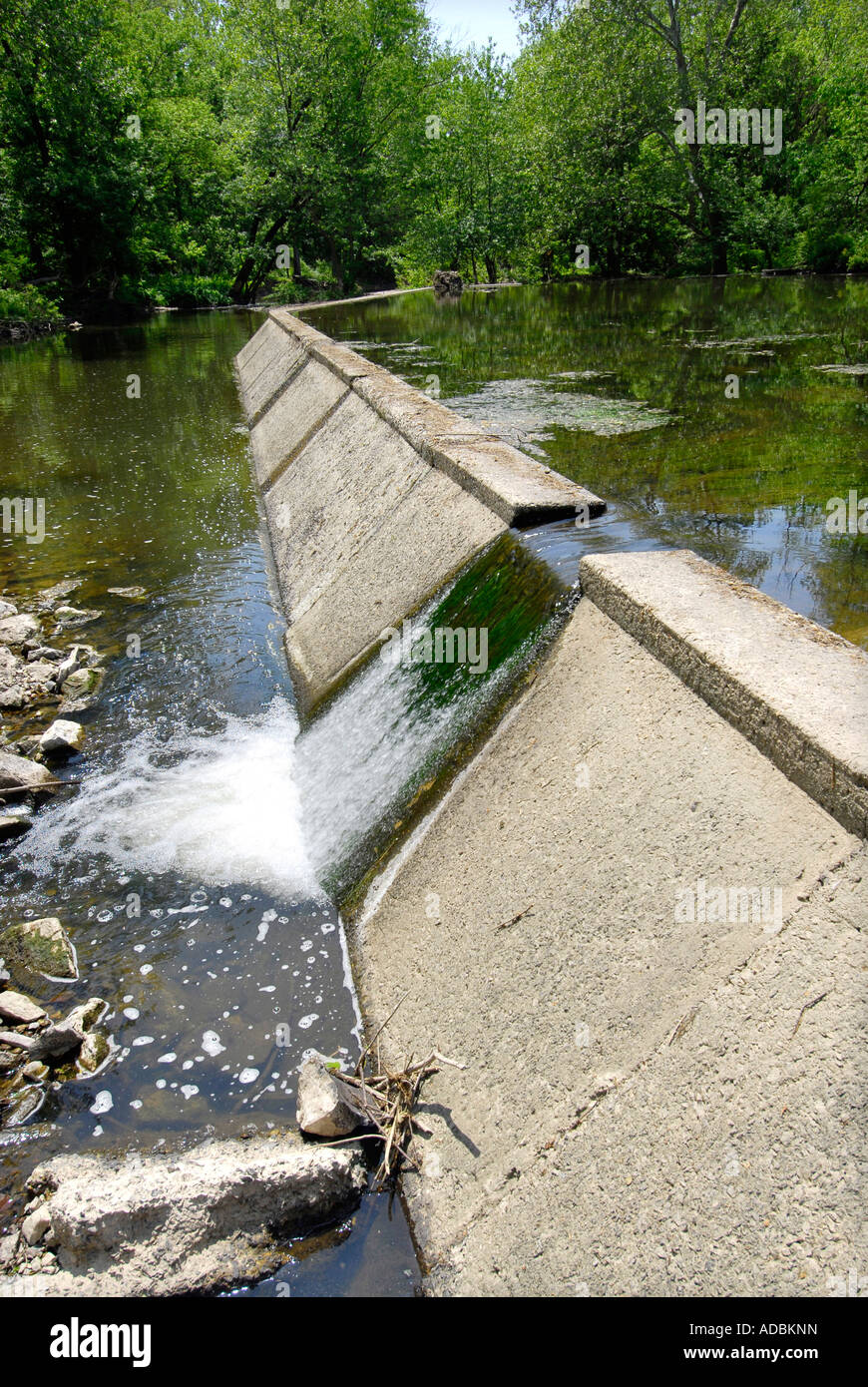Spillway over a small dam regulates the amount of water in an ...