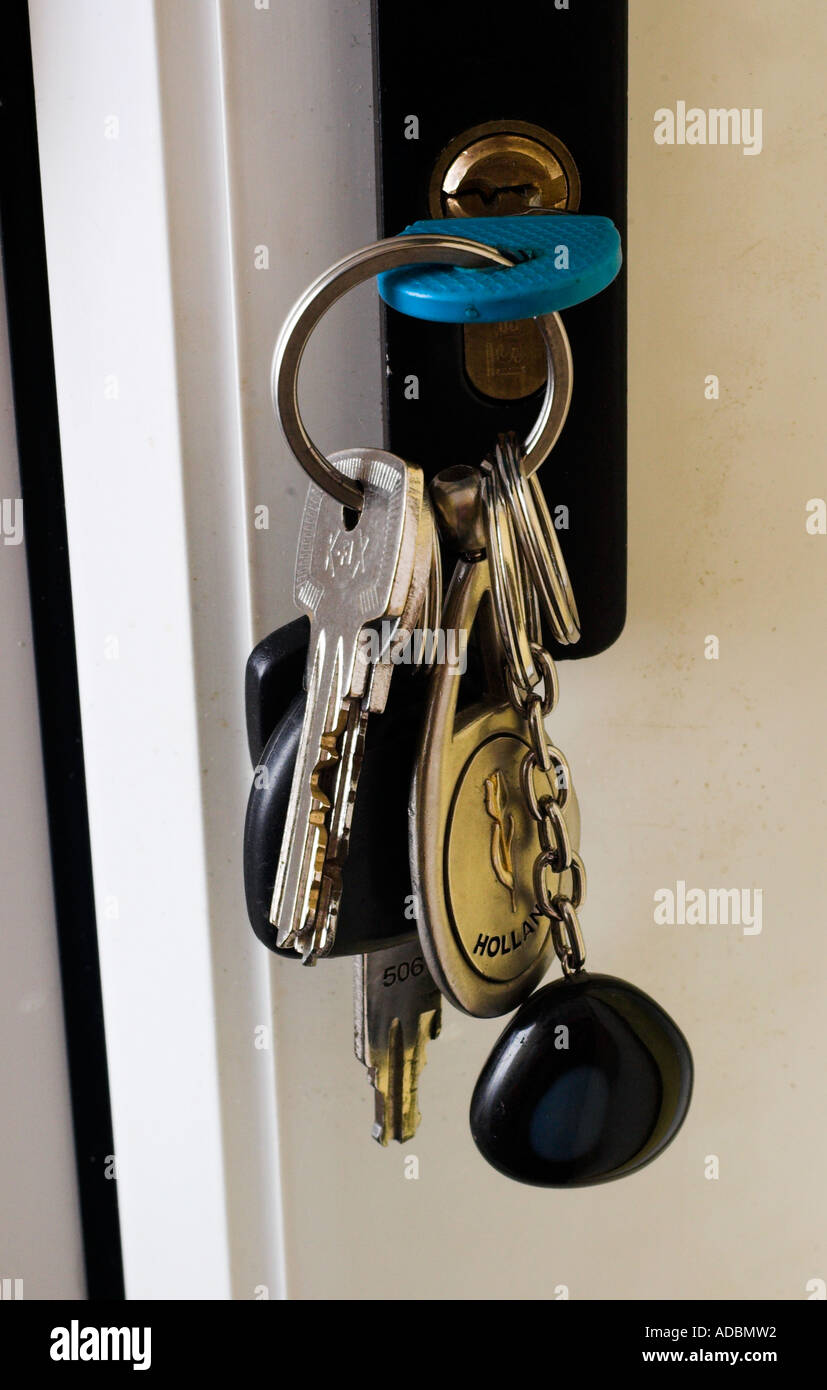 Keys in a door lock Stock Photo - Alamy