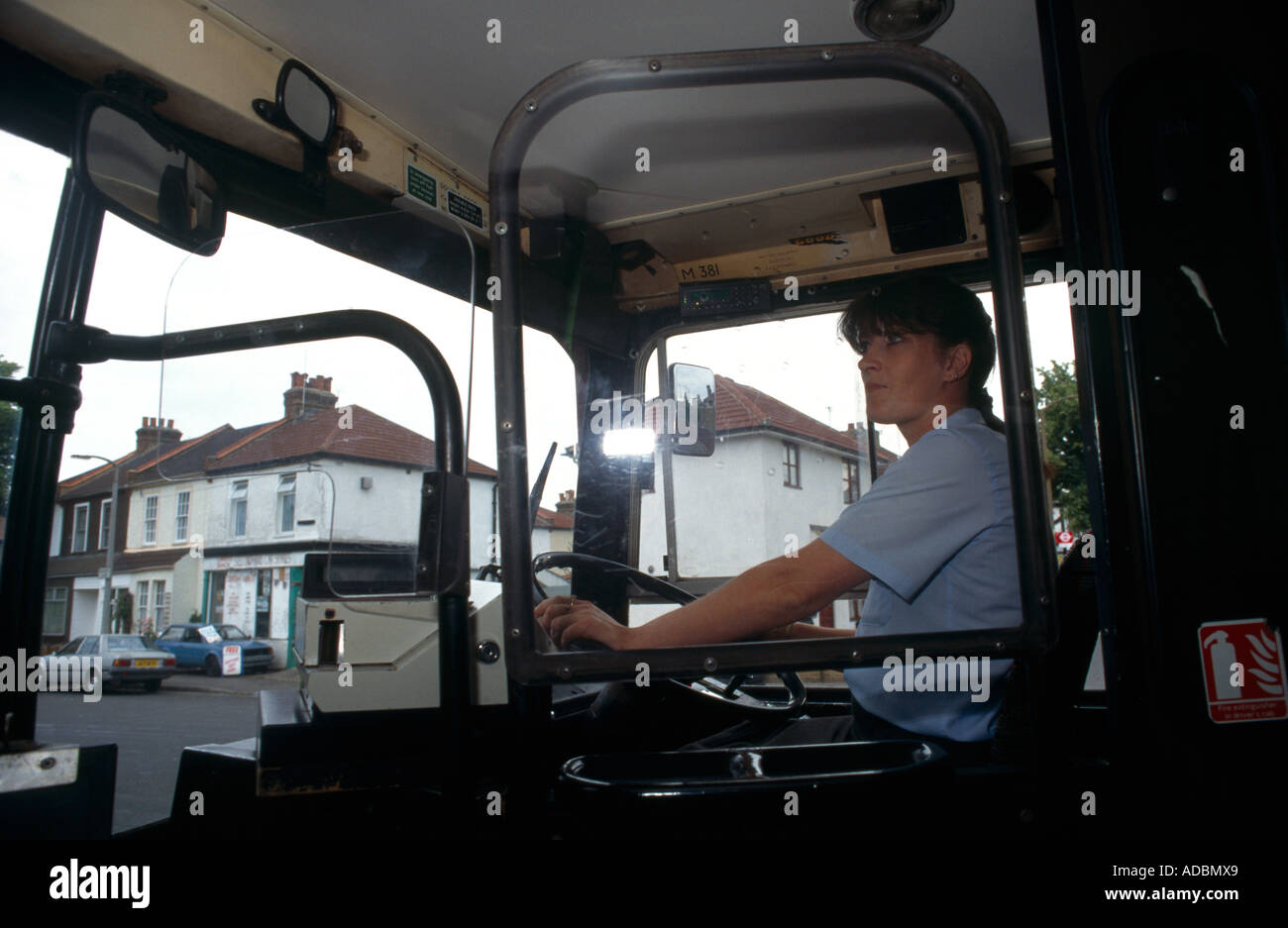 Female Bus Driver With Both Hands On Steering Wheel Stock Photo - Alamy