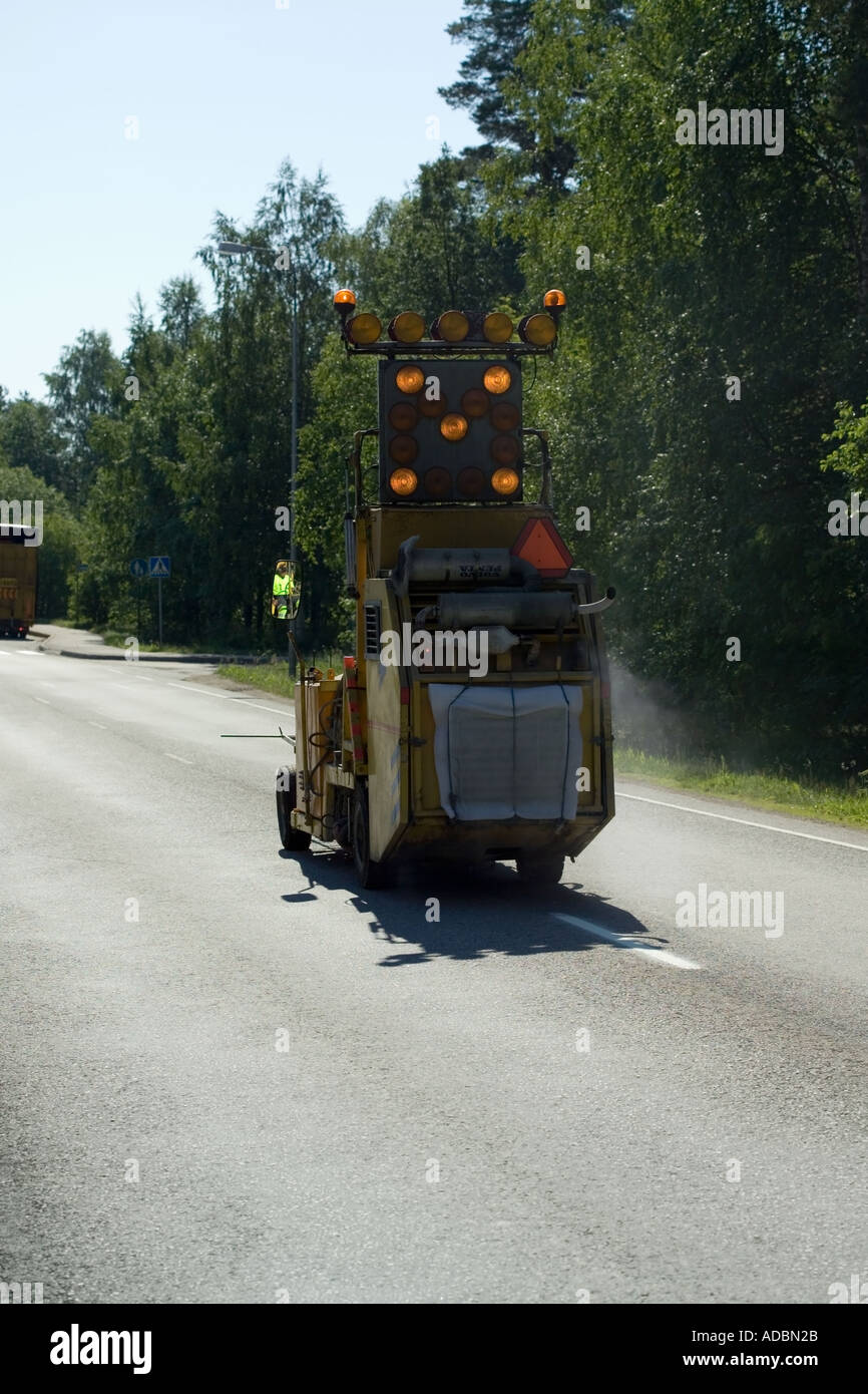 painting lines on the road Stock Photo - Alamy