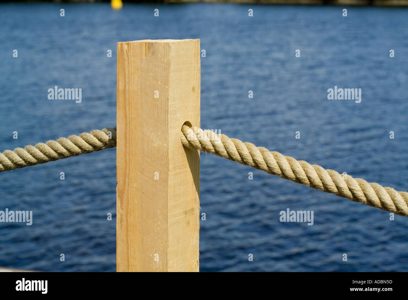 rope through wooden pole Stock Photo - Alamy