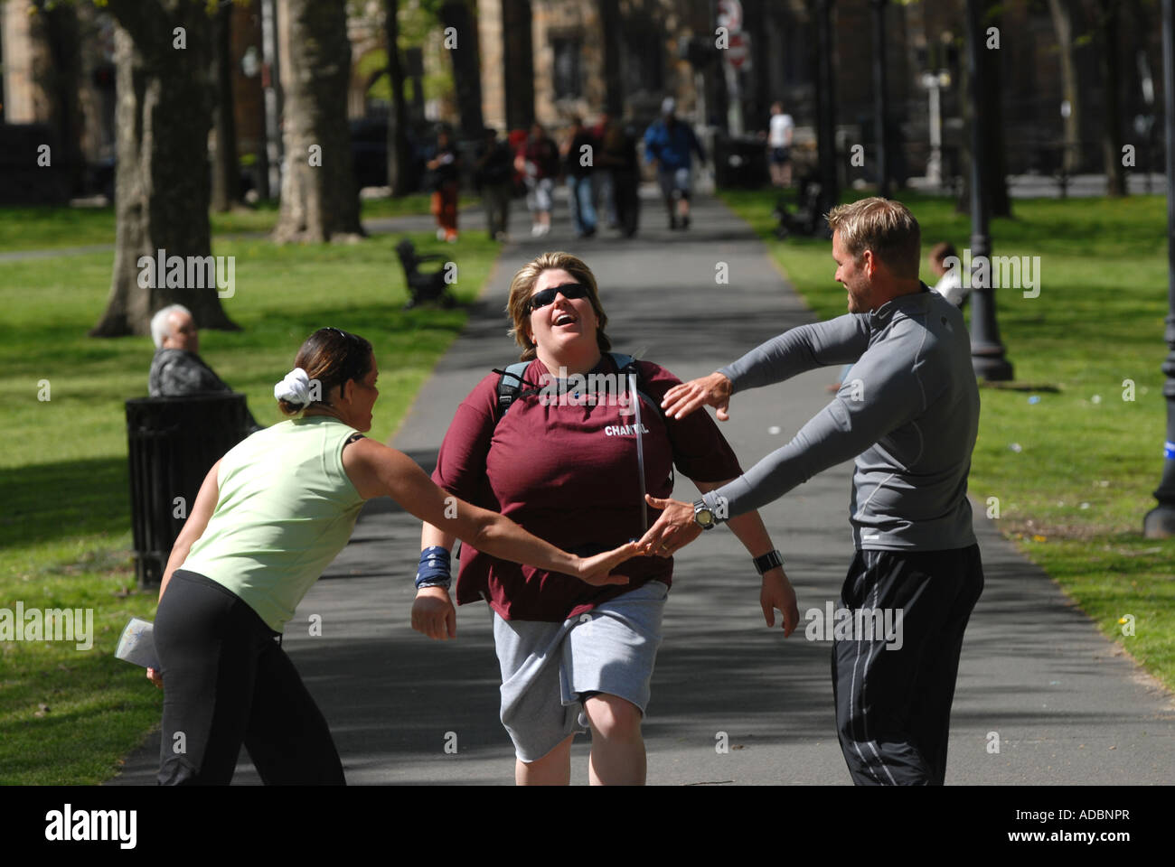 Trainers Lorrie Henry and Steve Pfiester congratulate a contestant as ...